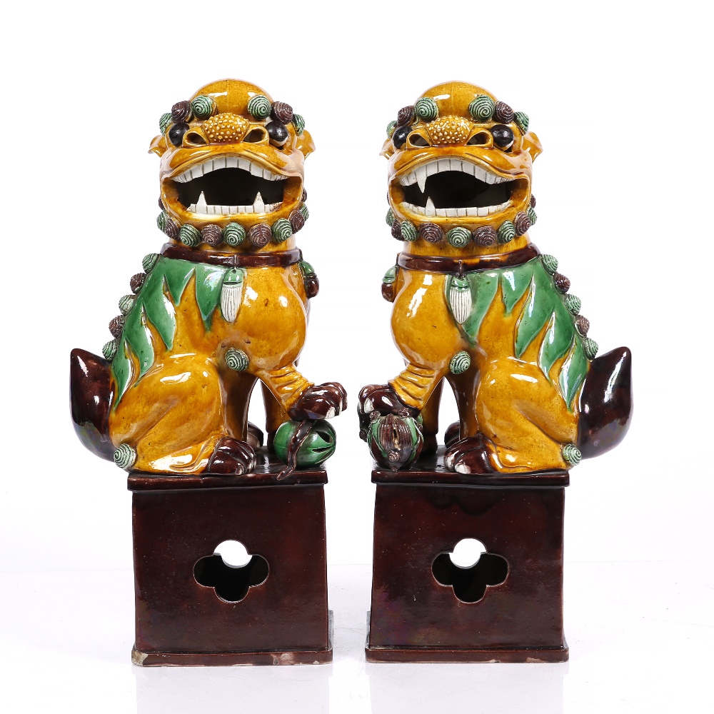 Lot 470 - A pair of Chinese glazed temple dogs