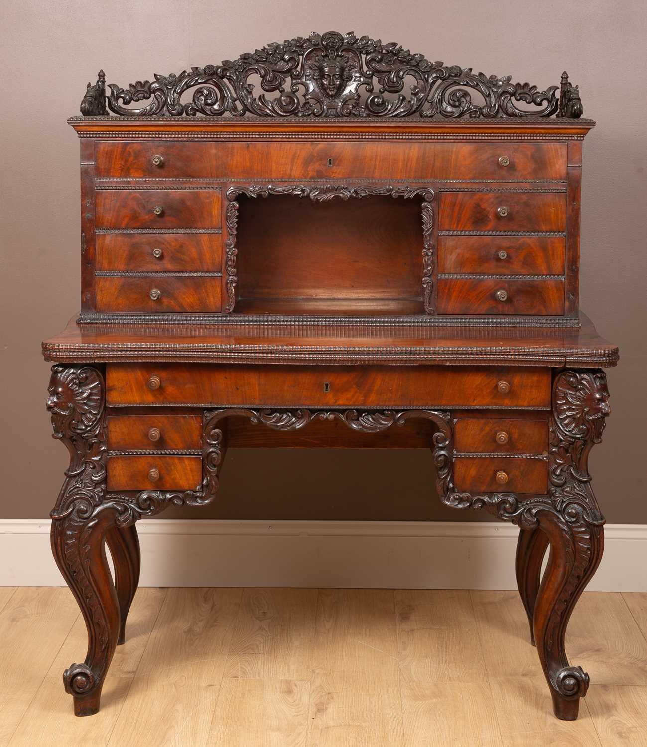 Lot 67 - An Irish style mahogany writing desk with a