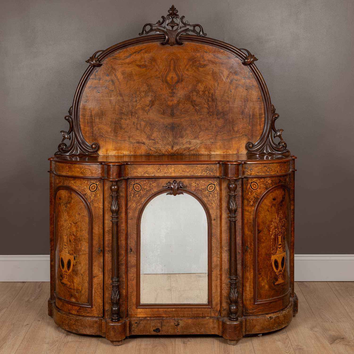 Lot 42 - A Victorian walnut credenza with a shaped