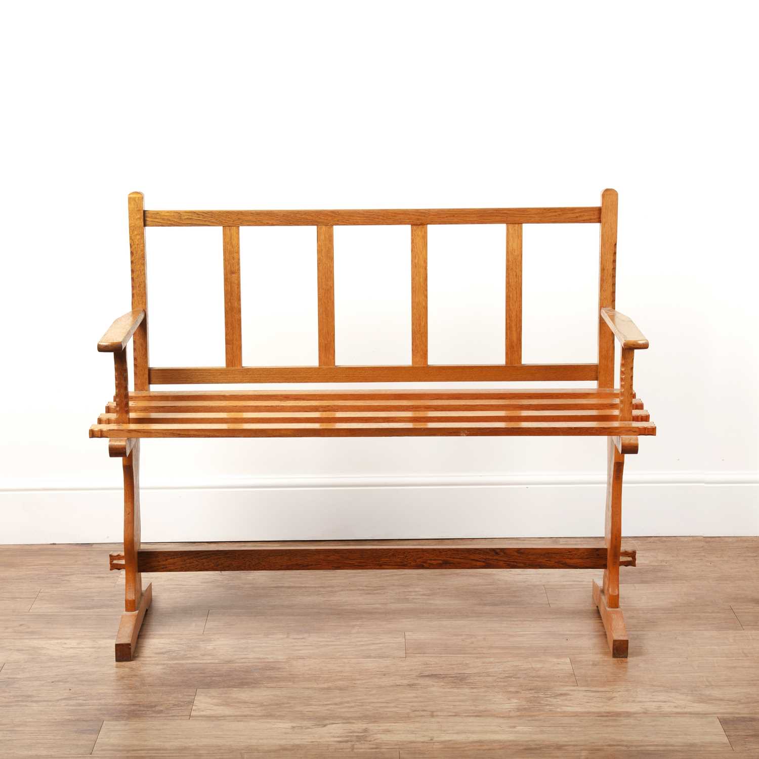 Lot 55 - Cotswold School style oak, bench, with carved