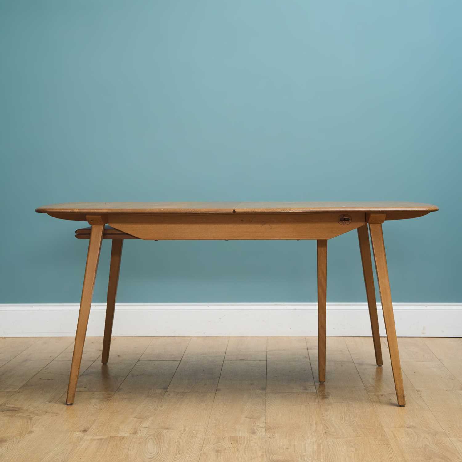 Lot 1169 - An Ercol dining table and chairs
