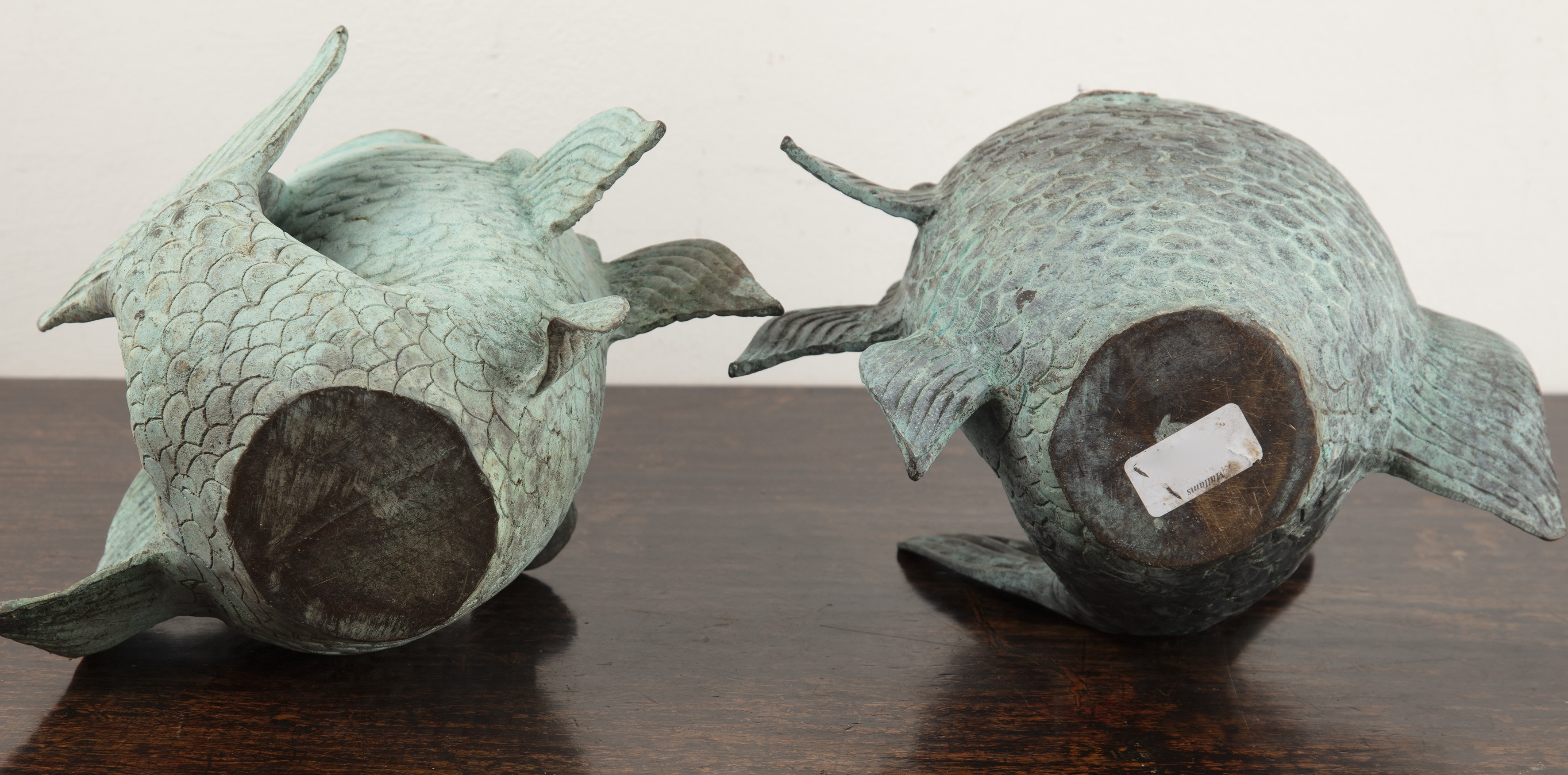 Lot 62 - Pair of bronze model koi fishes depicted with