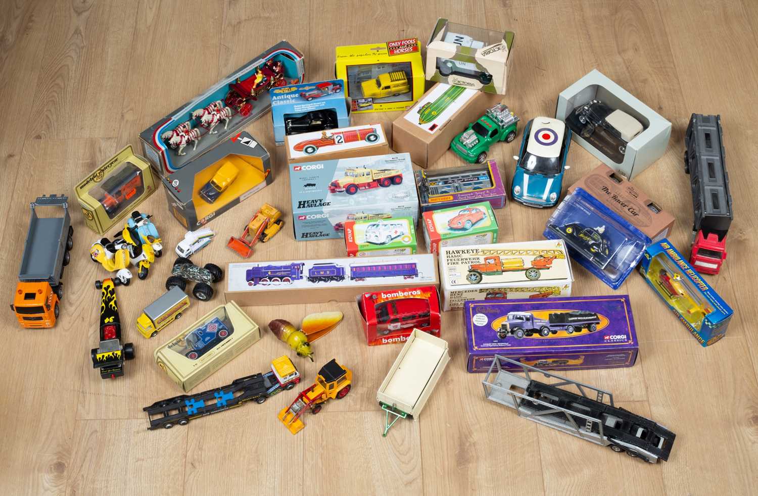 Lot 102 - A collection of mostly boxed toy cars to